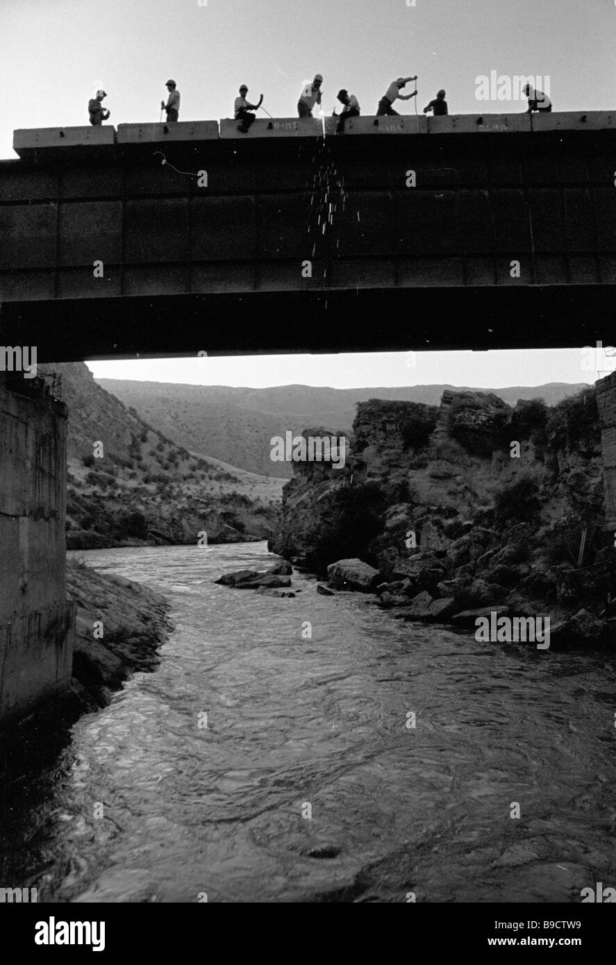 Building the first transportation bridge over river Vakhsh Stock Photo ...