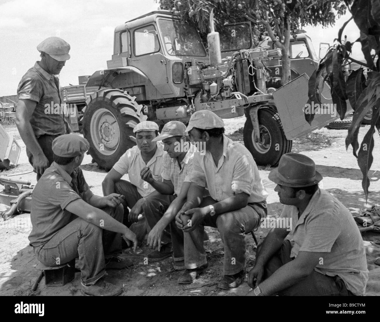 Soviet farming machinery repairmen discuss current issues Stock Photo ...