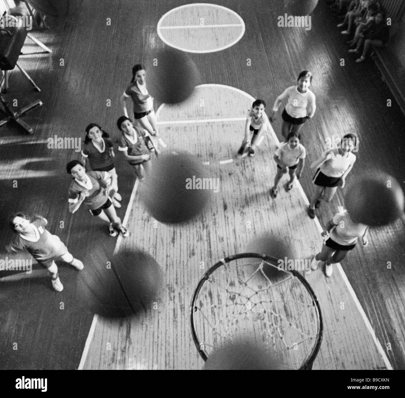 Young basket ball players practicing ring shots Stock Photo - Alamy