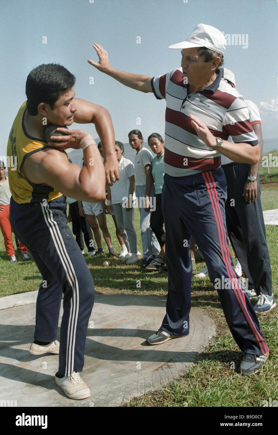 Soviet decathlonist Alexander Ushakov right training the track and ...