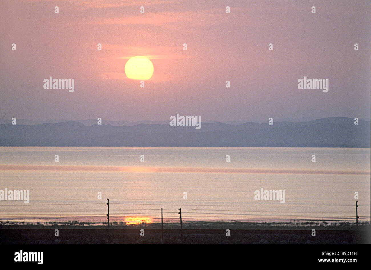 Dusk over Tajik Sea reservoir formed by Karakum dam on the Syrdarya ...