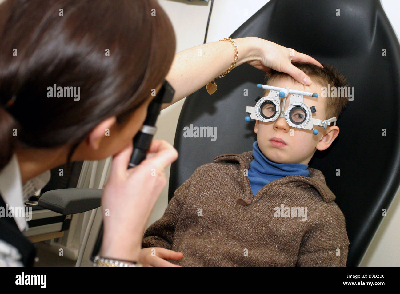 Young child having eyes tested with optical goggles being tested Stock ...