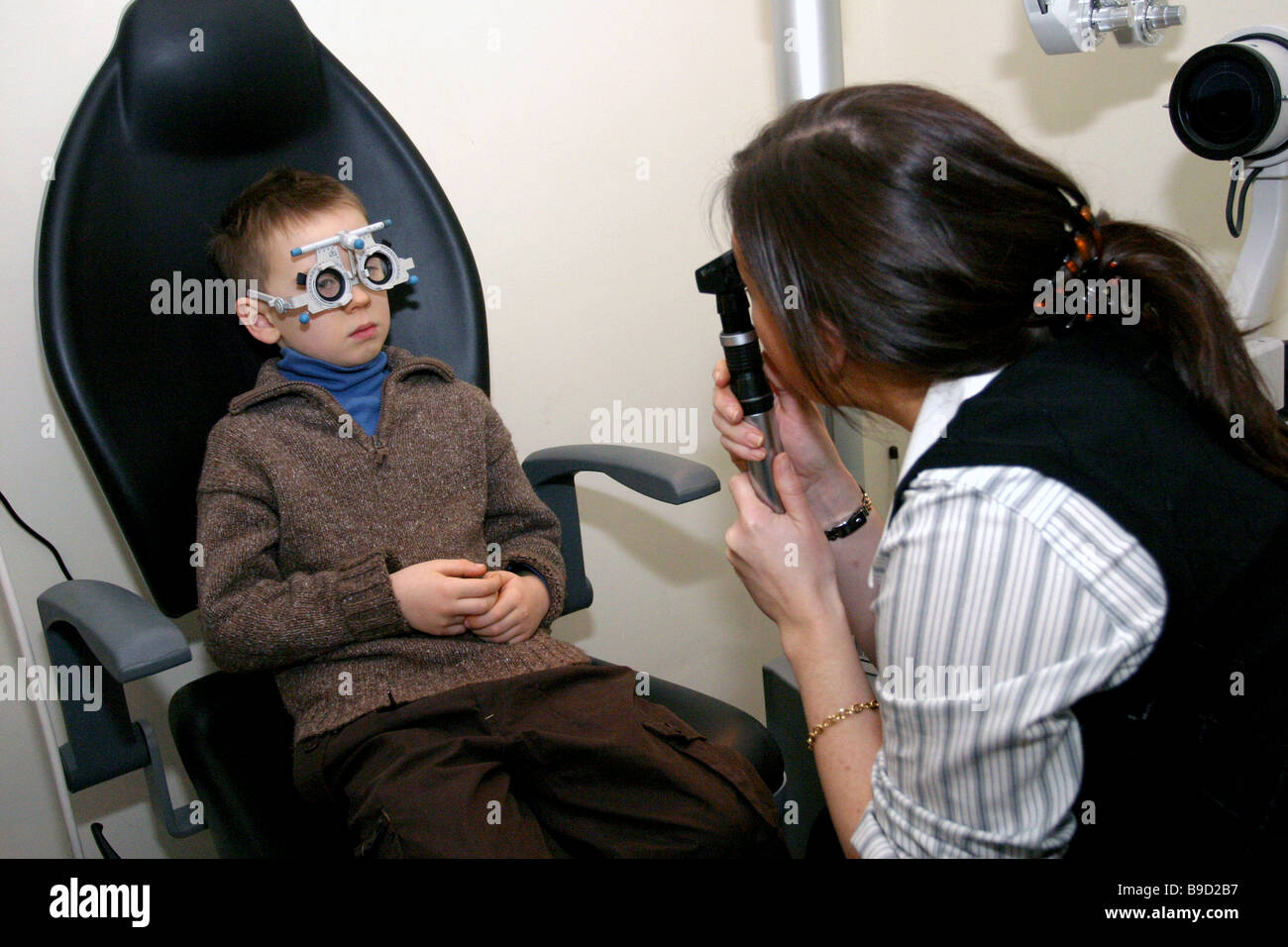 Young child having eyes tested with optical goggles being tested Stock ...