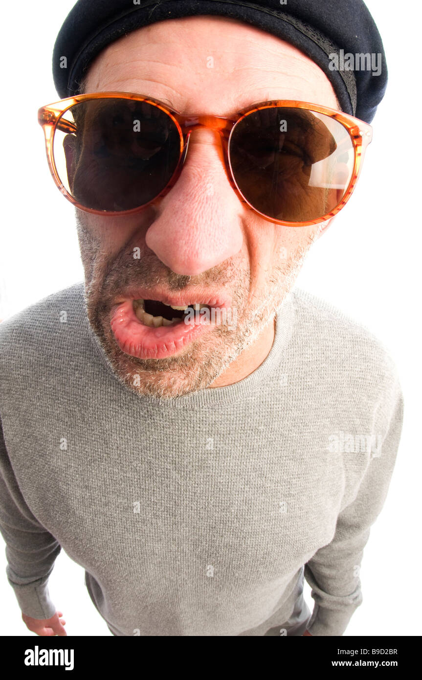 middle age senior man grumpy funny face twisted mouth wearing artist ...