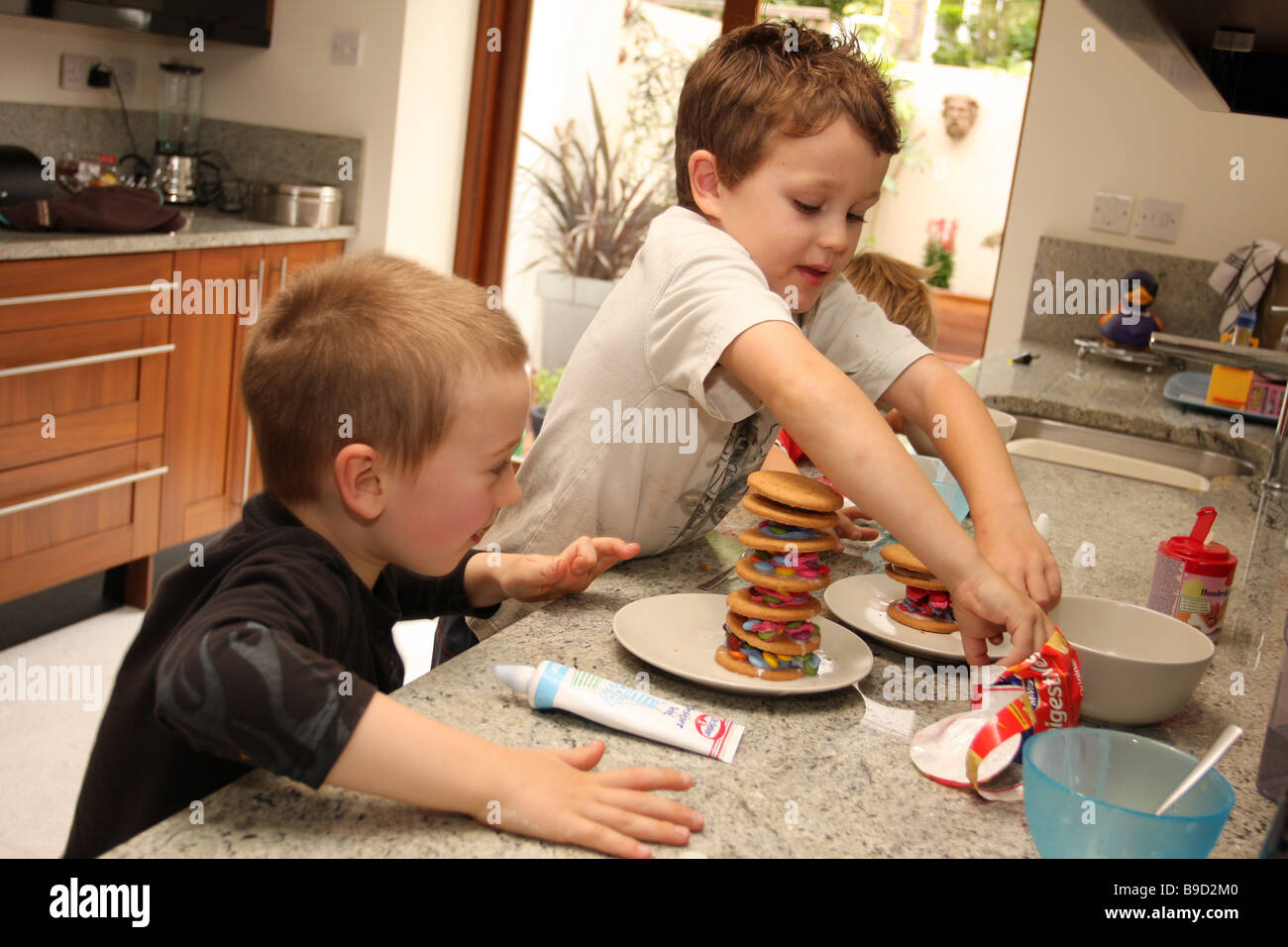 Children in kitchen making baking biscuit making and decorating Stock ...