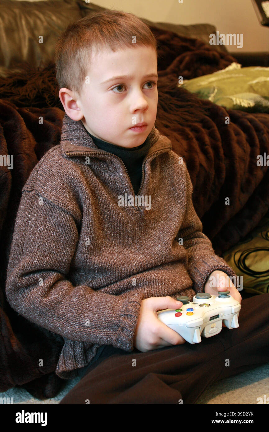 young child on computer console control playing games Stock Photo - Alamy