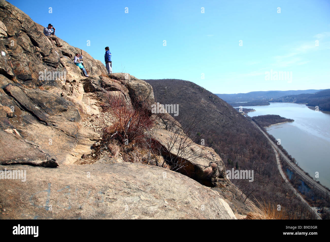 Hikers taking a break at the fabled cliffs of Breakneck Ridge, Hudson ...