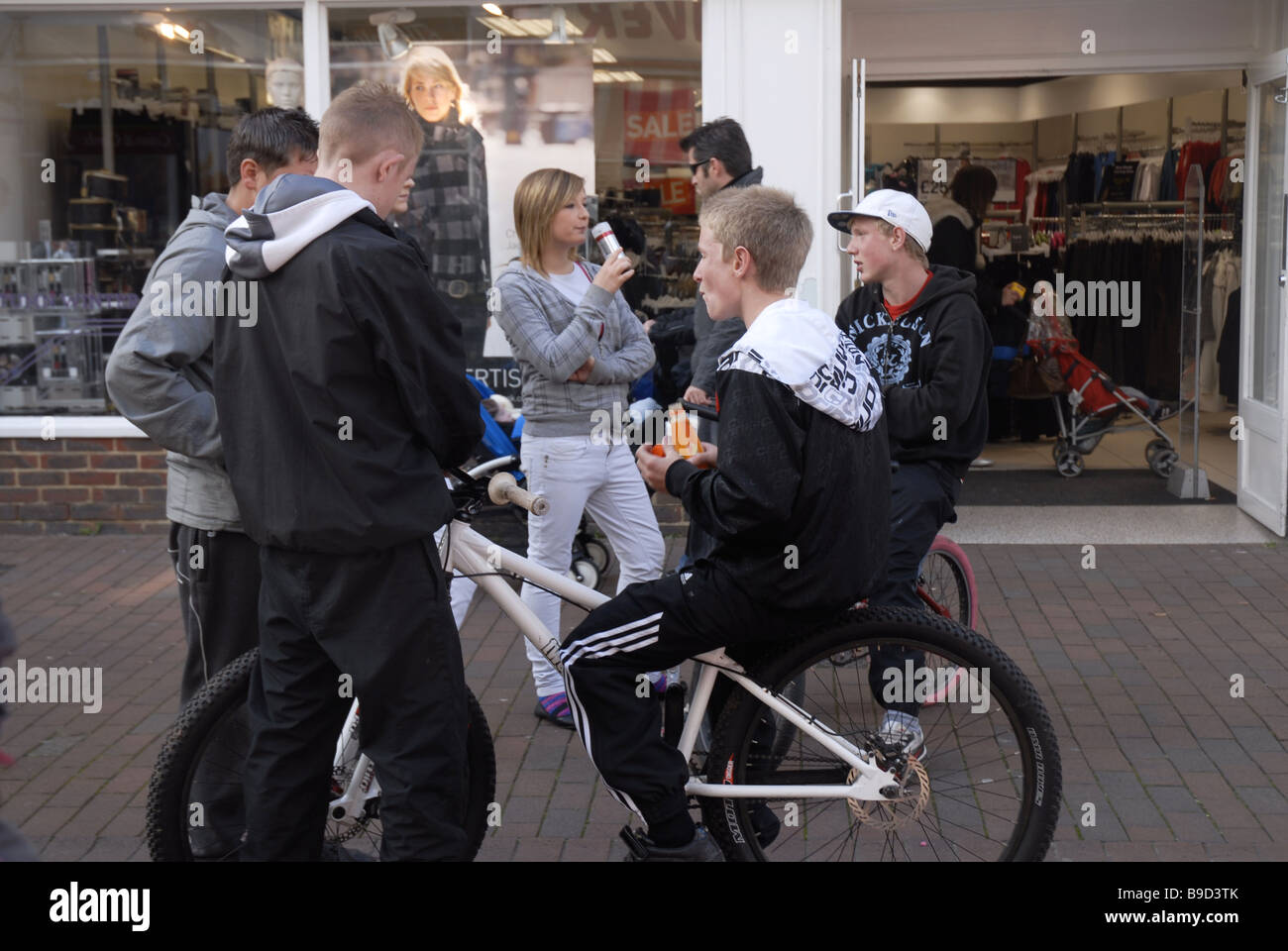 Young teenagers hanging around street Stock Photo - Alamy