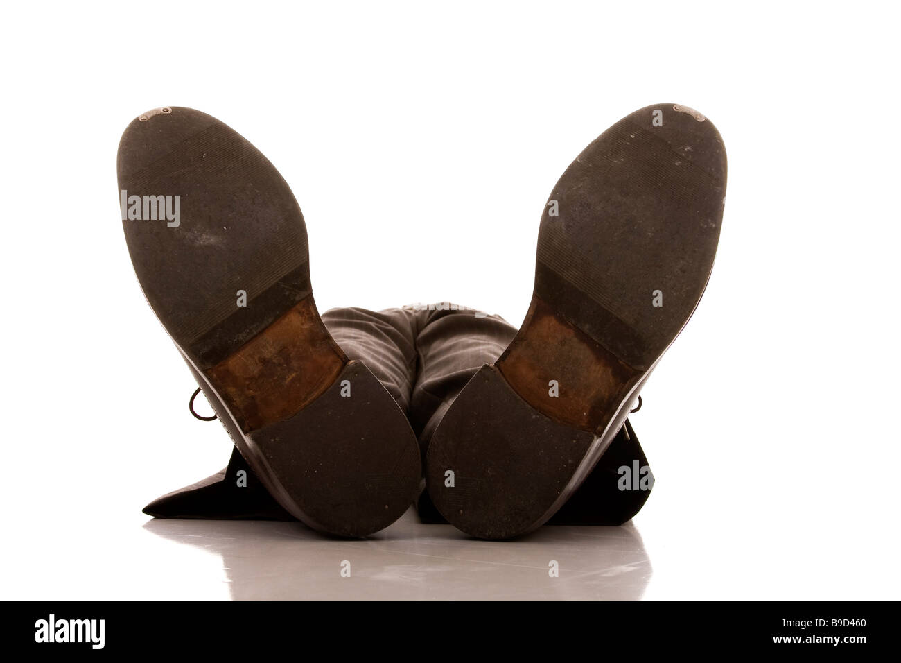 businessman feet of a dead body isolated on white Stock Photo - Alamy