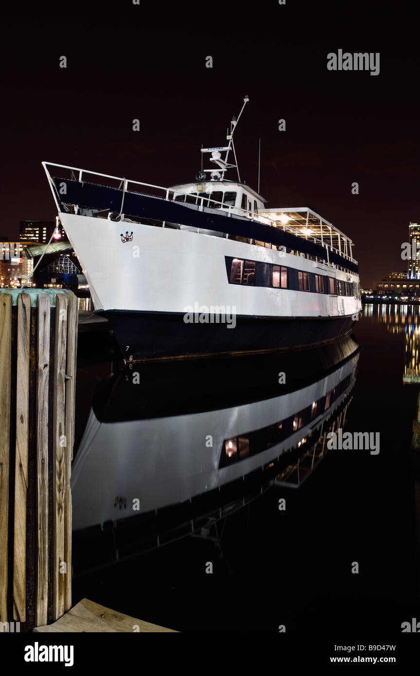 A night view of a large boat with mirrored reflection Stock Photo - Alamy