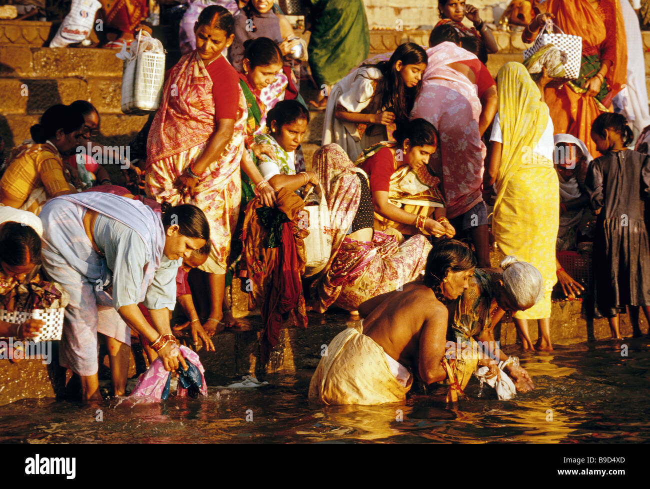 Varanasi (Benares), Women pilgrims on Ganga Mahal Ghat along sacred ...