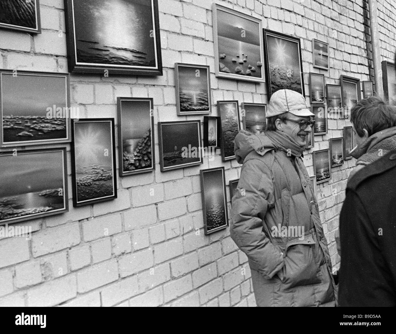 An artist with his works at the Vilnius spring fair Stock Photo - Alamy