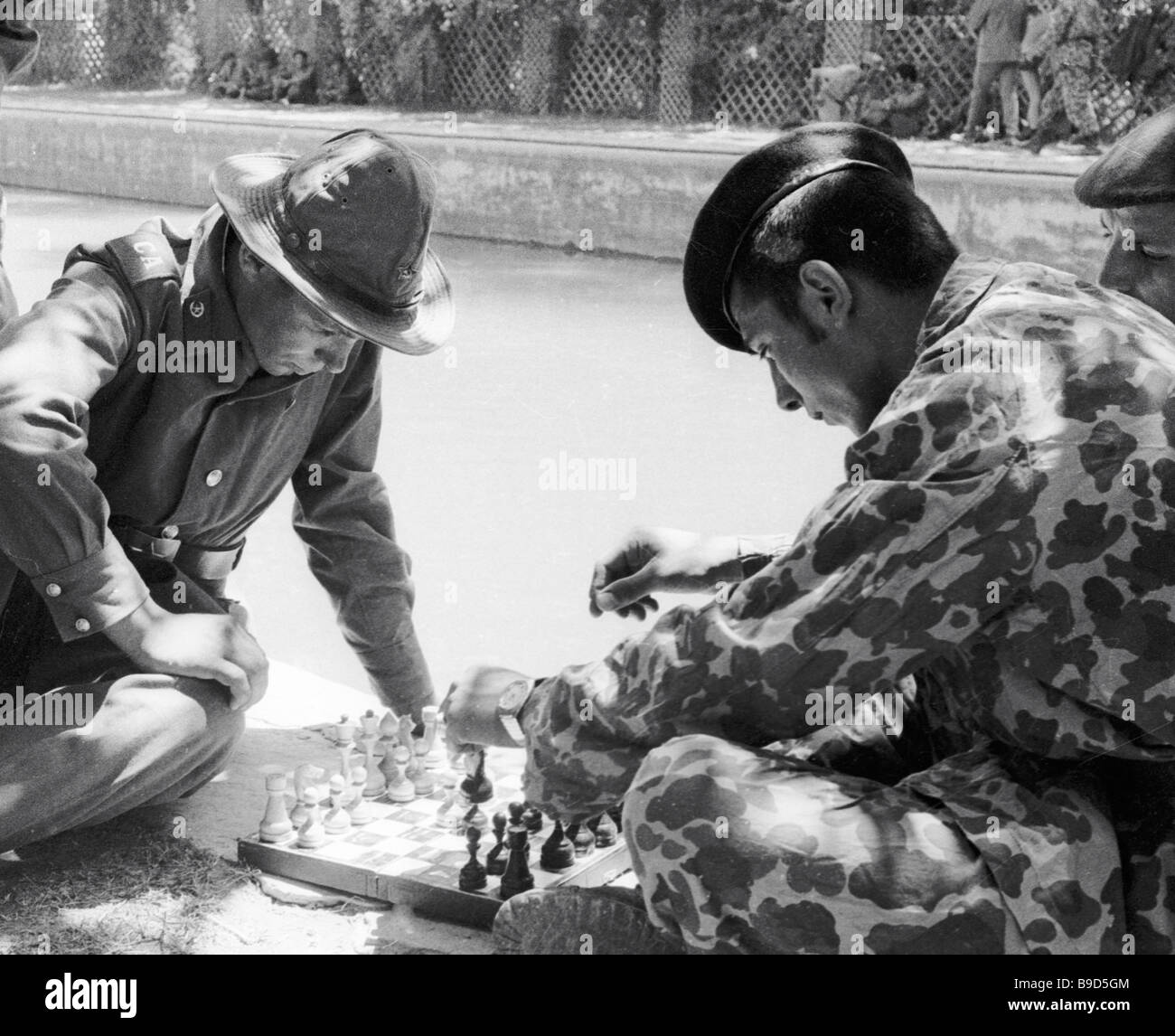 An Afghan soldier is playing chess with a Soviet soldier Stock Photo ...