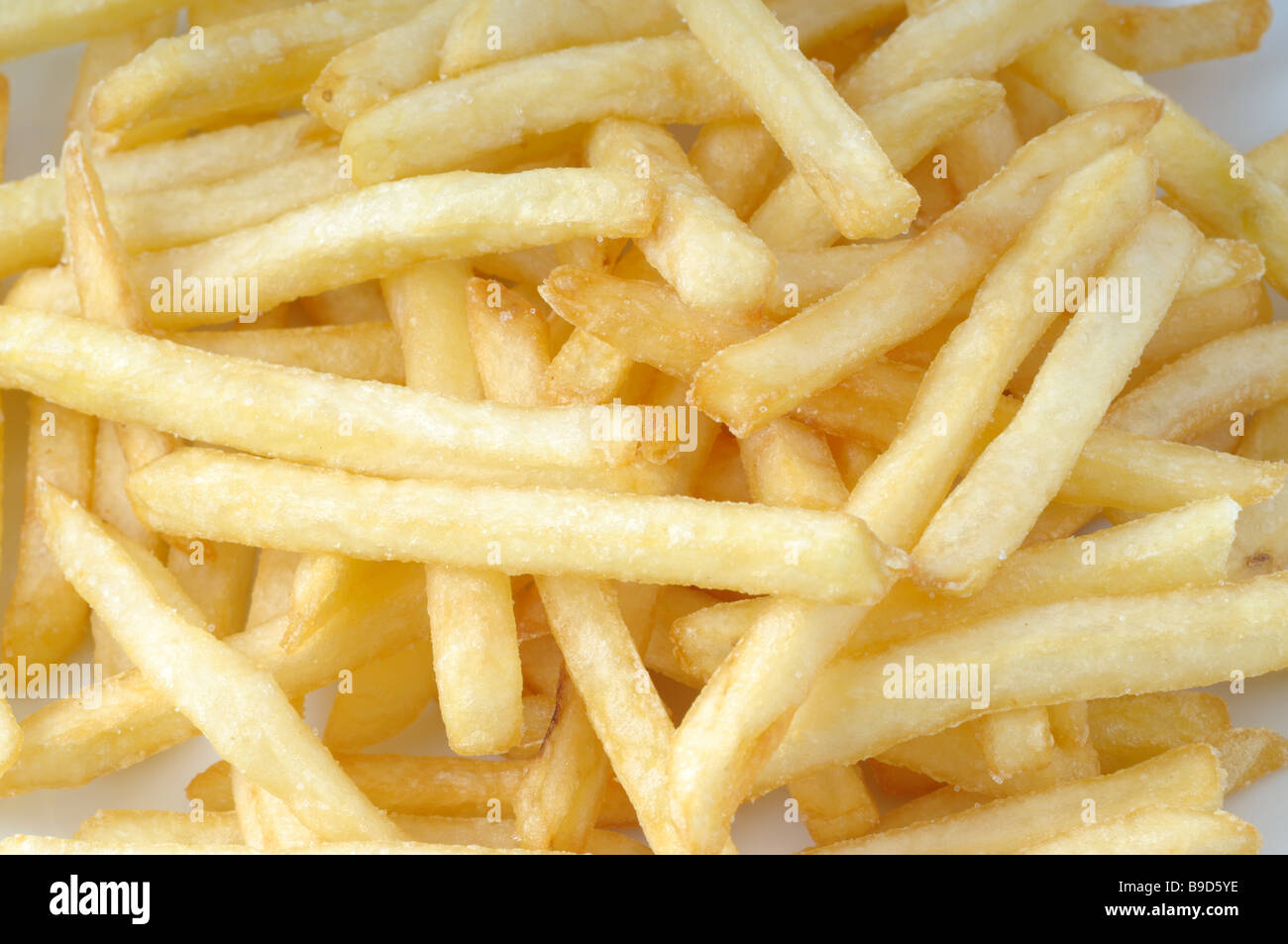 Closeup of afrench fries as a background Stock Photo - Alamy