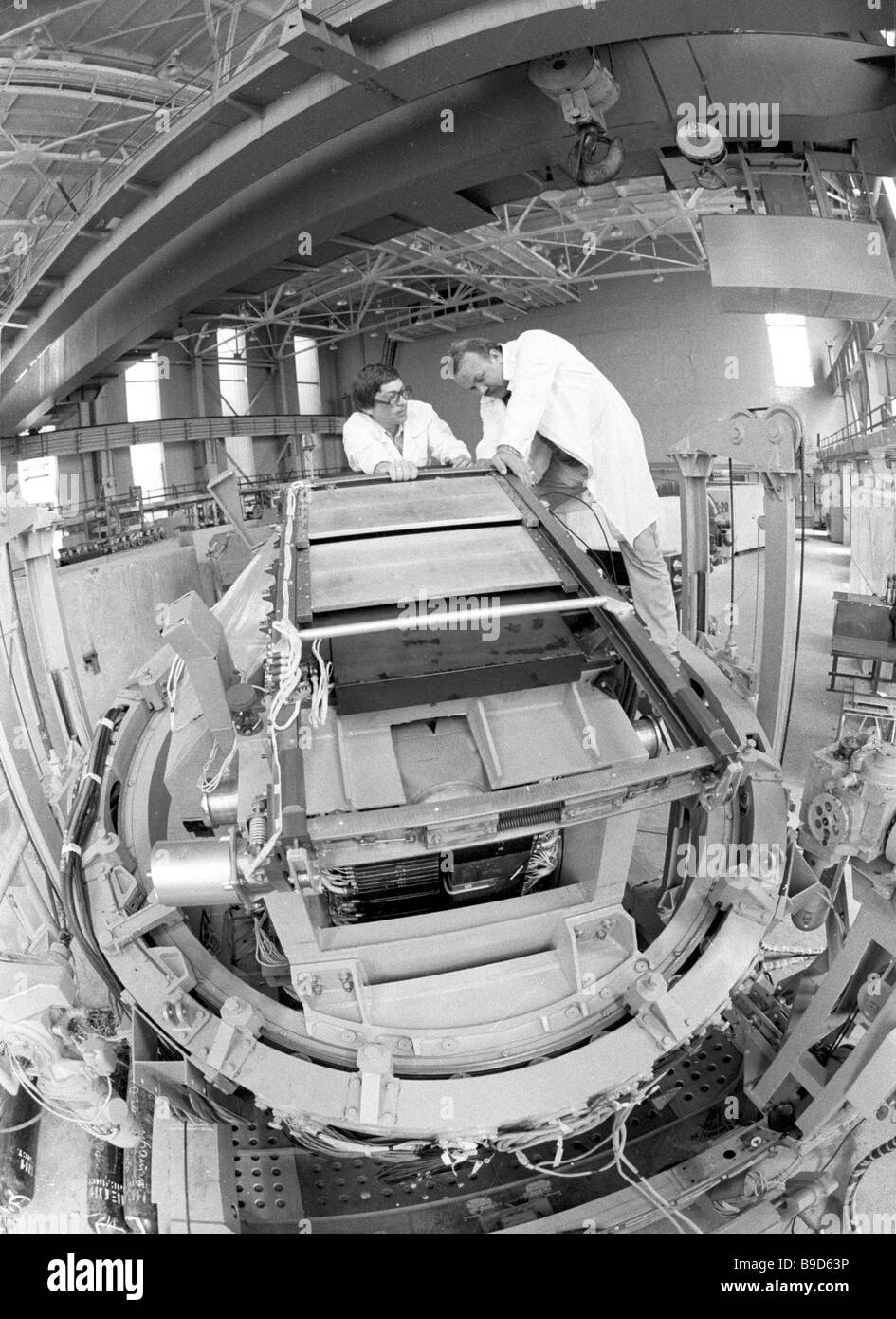 Scientists check the gamma ray telescope on a beam of marked ...
