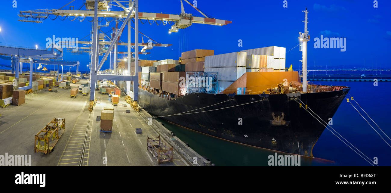 cargo ship at dock by night panorama Stock Photo - Alamy