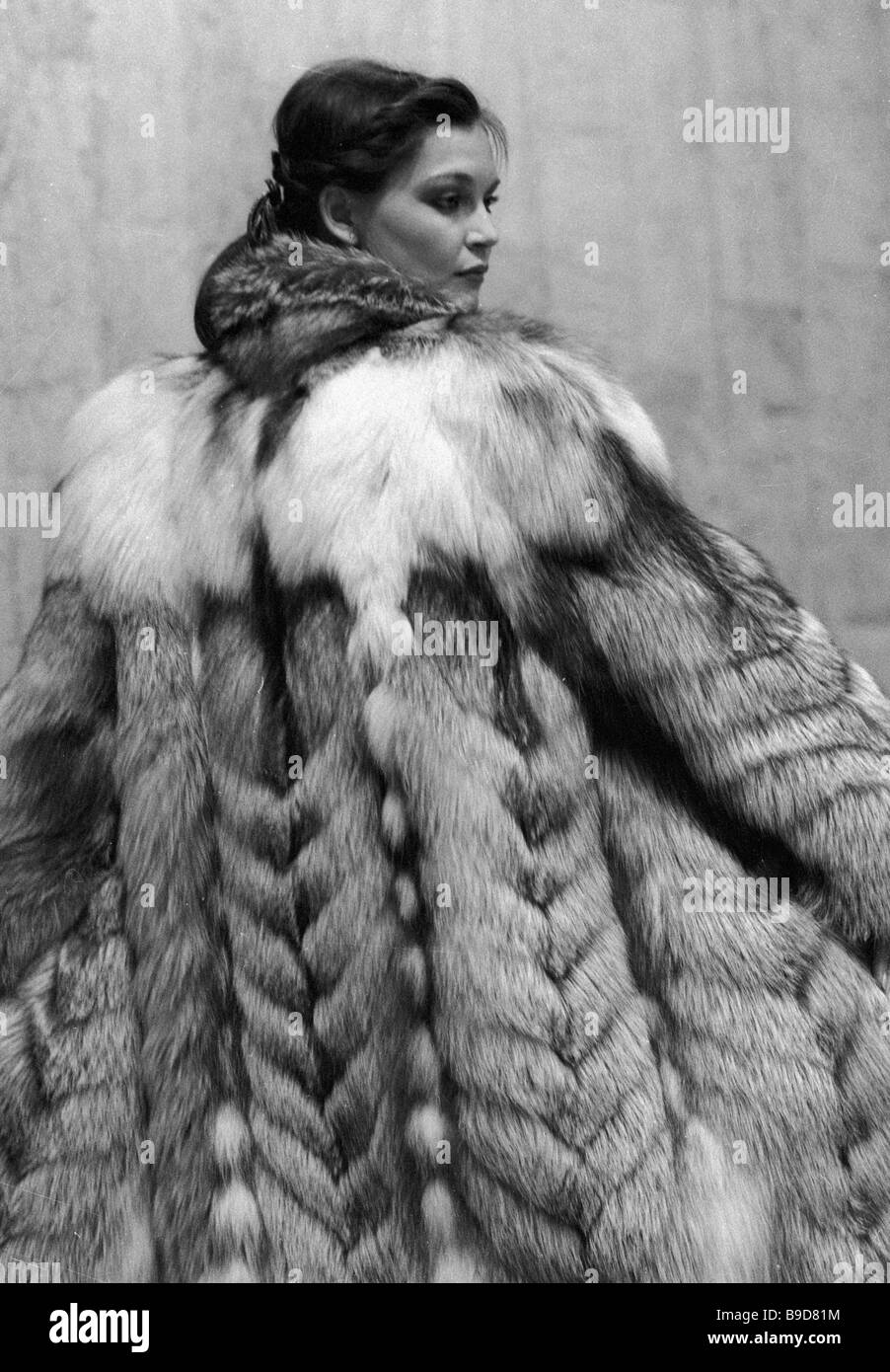 A model displaying a platina fox fur cloak Stock Photo - Alamy