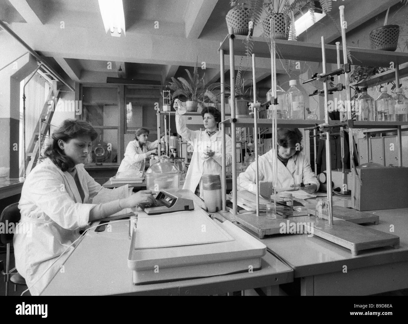 Plastics factory employees in the central lab Stock Photo - Alamy
