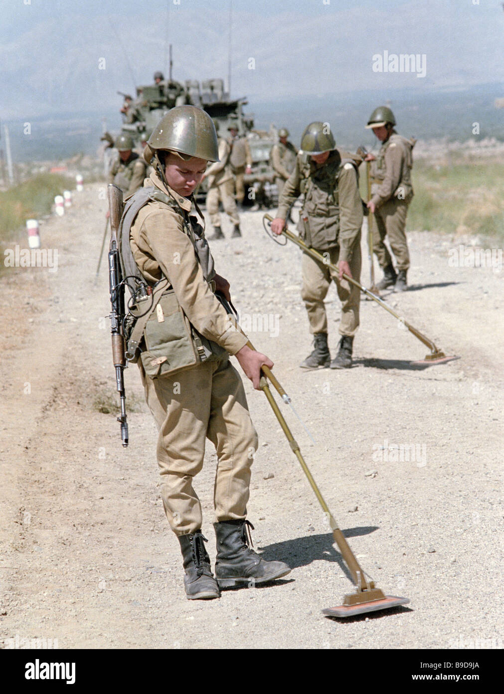 Soviet soldiers search for landmines on a road in Afghanistan Stock ...