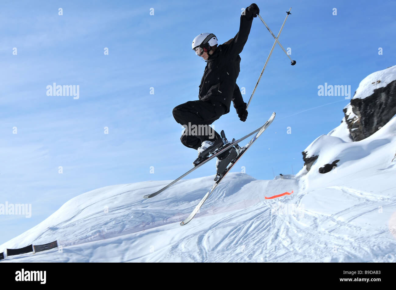 skier in black jumping Stock Photo - Alamy