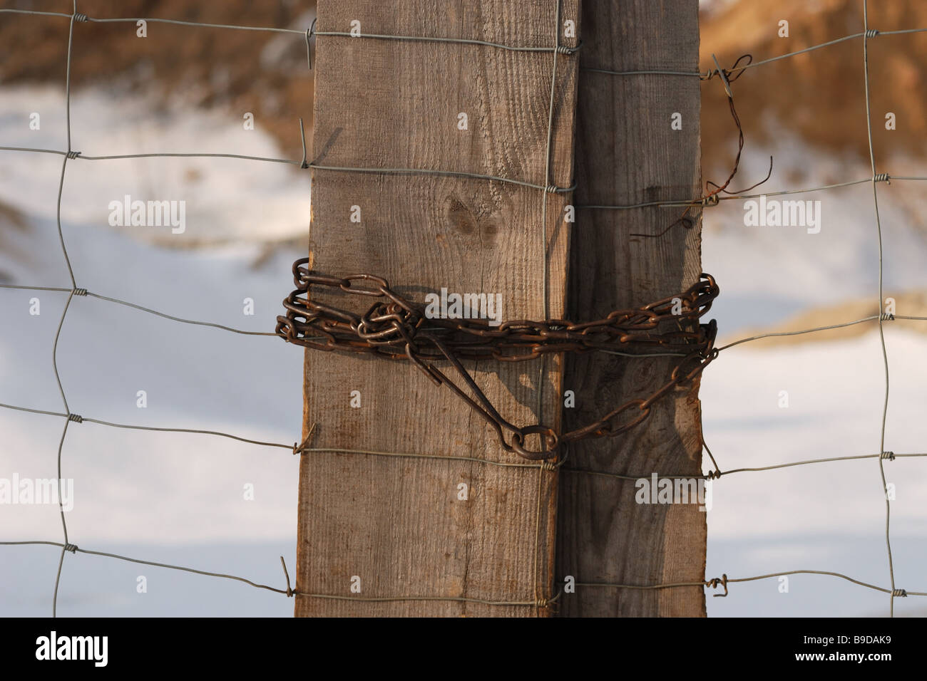 Old wooden gate closed with chain Stock Photo - Alamy