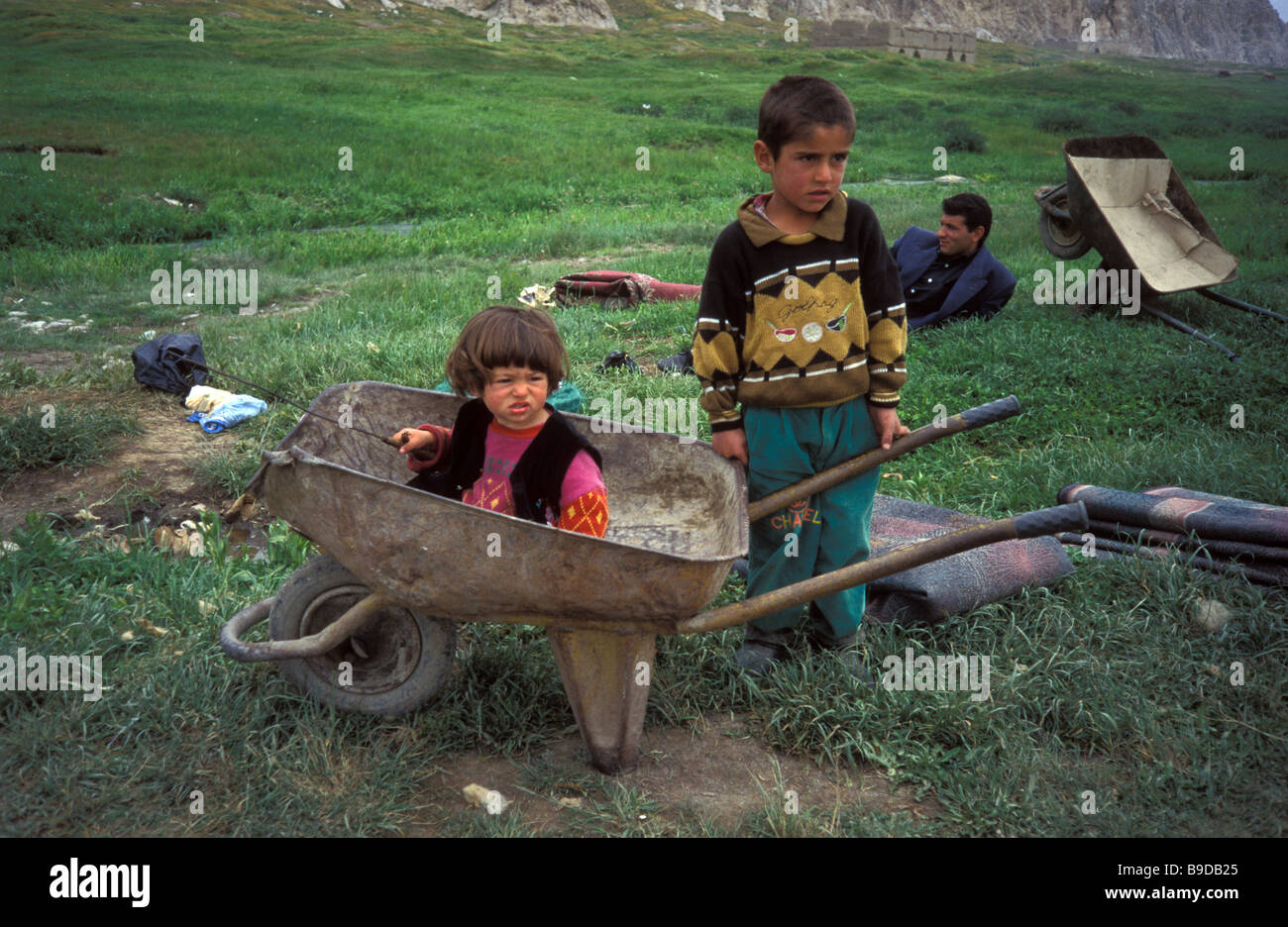 kurdish children playing in wheelbarrow rock of Van Turkey Stock Photo ...