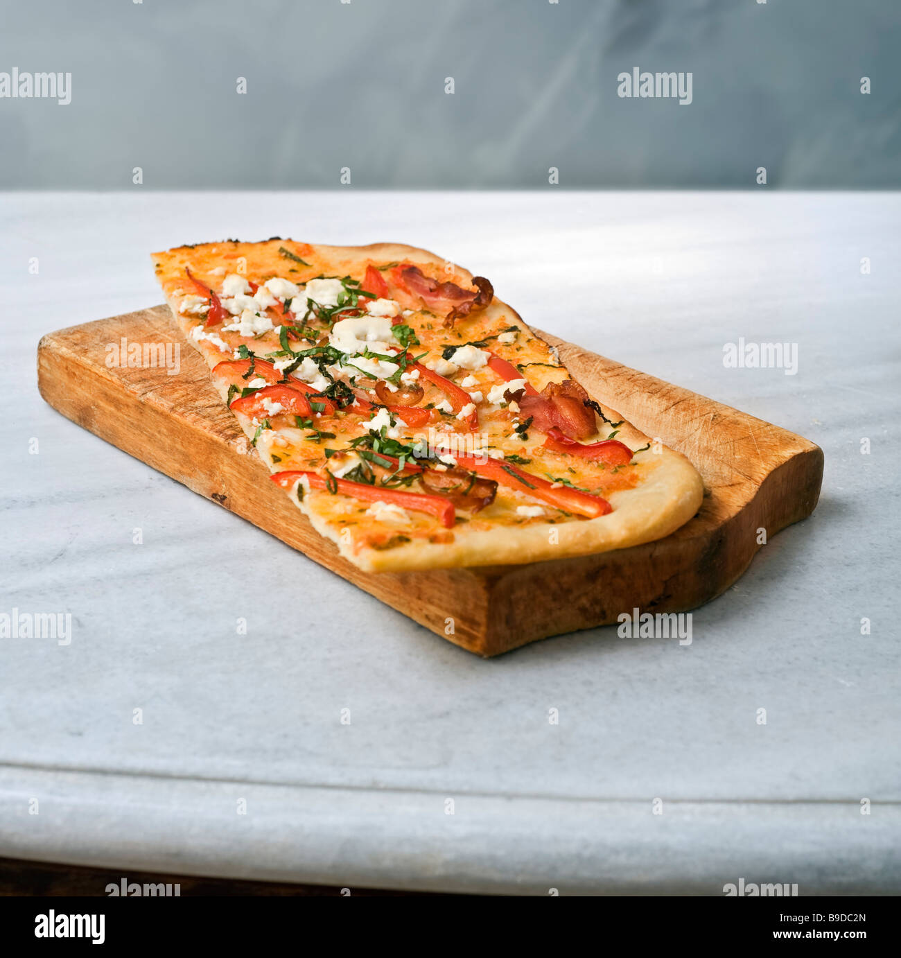 homemade pizza with peppers bacon and bazil Stock Photo - Alamy