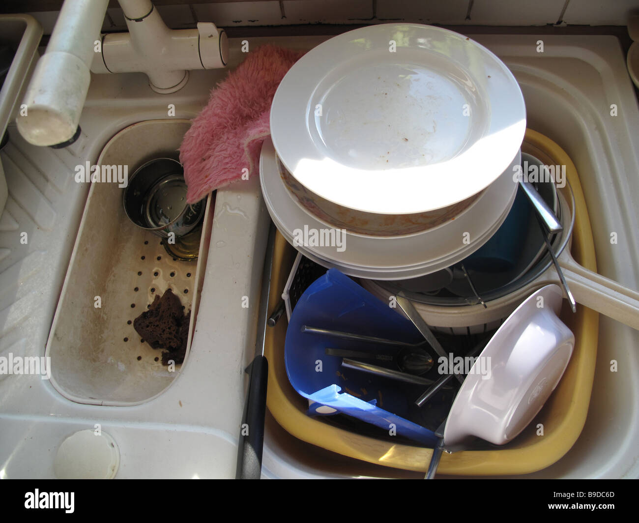Dirty dishes in sink Stock Photo - Alamy