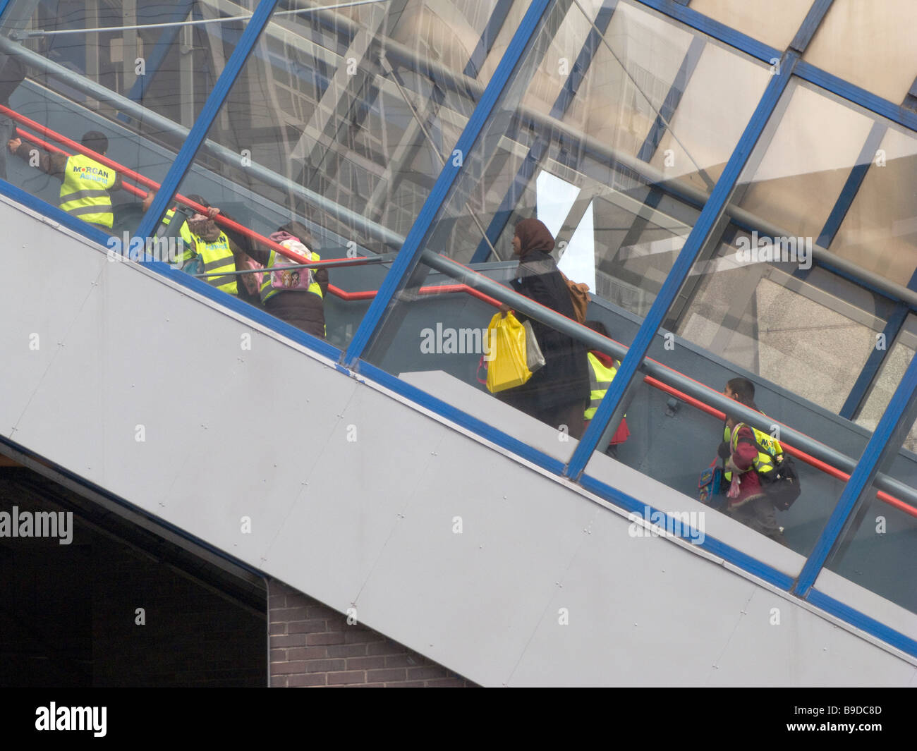 UK School children and teacher taking the tube on a day out in London ...