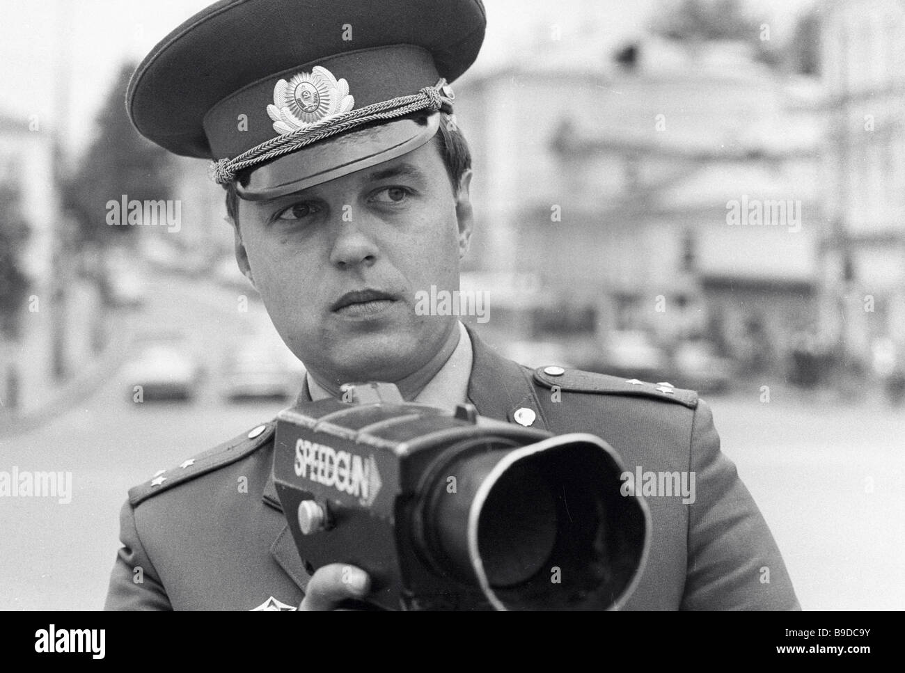 Traffic police officer on duty with a speed monitor Stock Photo - Alamy