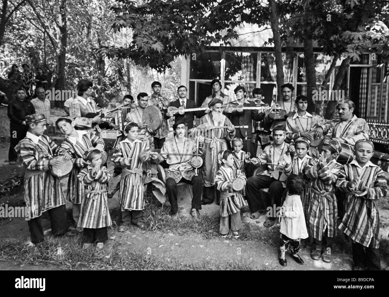 The Kholovs family band plays Tajik national instruments Stock Photo ...