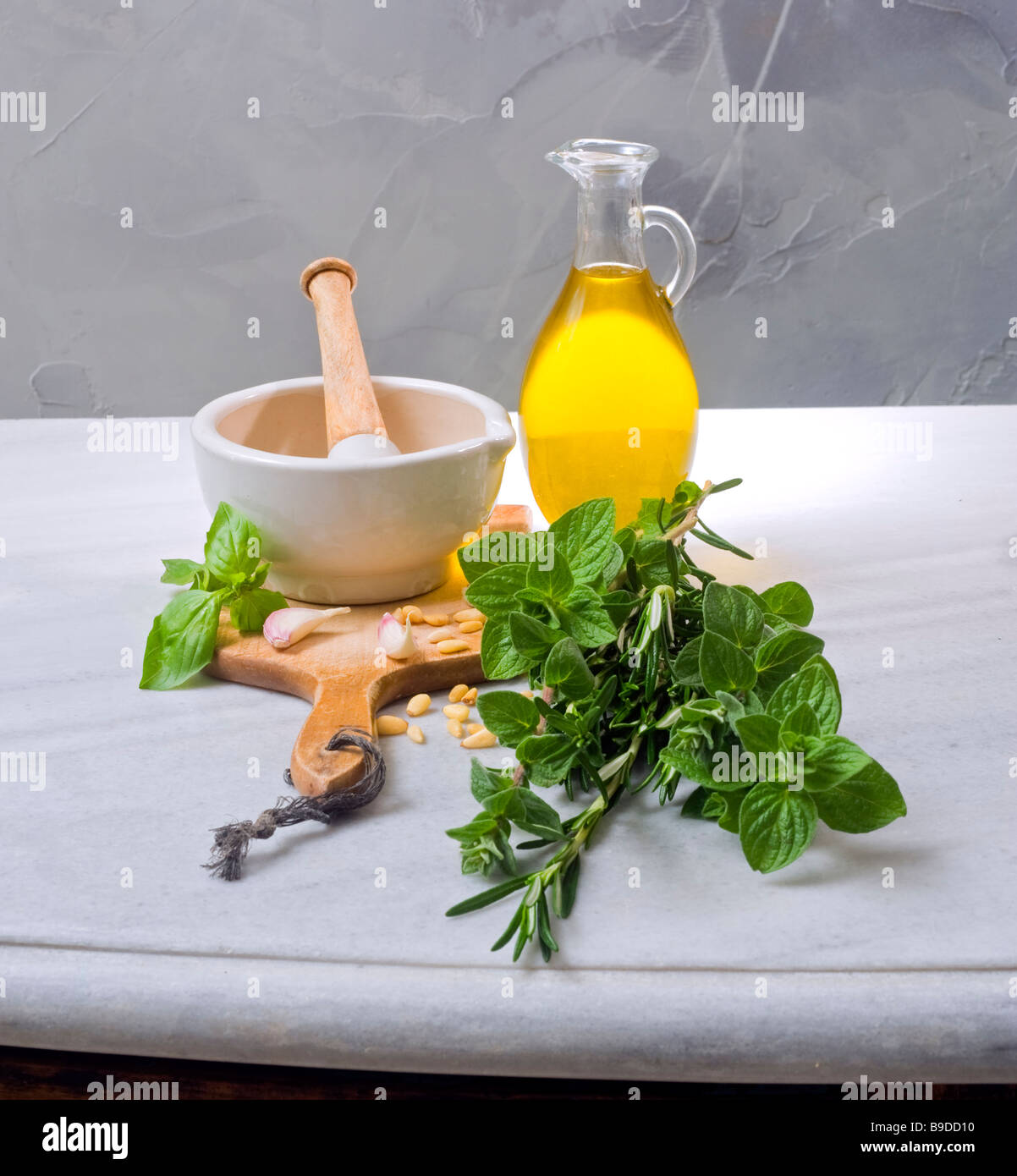 pestle mortar fresh herbs and olive oil Stock Photo - Alamy