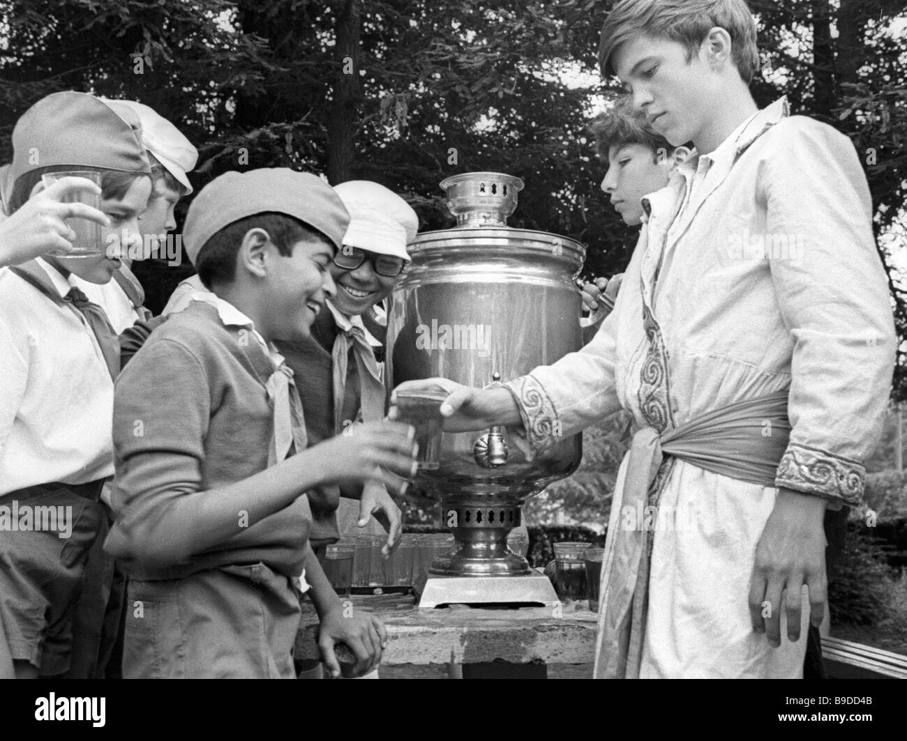 Indian children drinking tea from a samovar for the first time at the ...