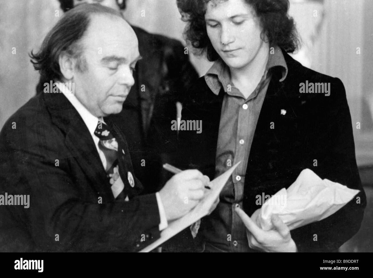 Soviet composer Vladimir Shainsky giving an autograph to a winner of ...