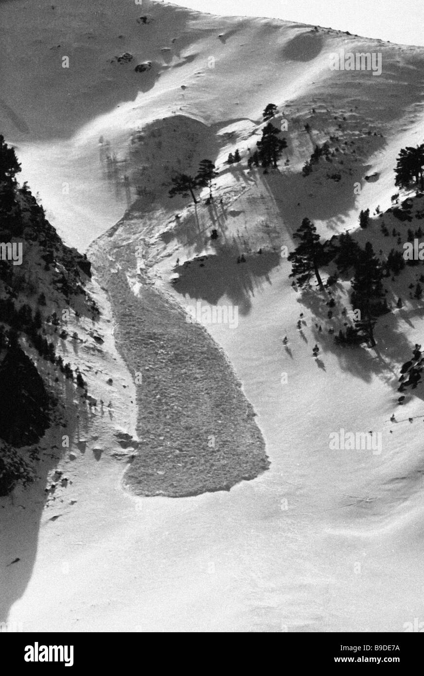 Snowslide in the mountains Stock Photo - Alamy