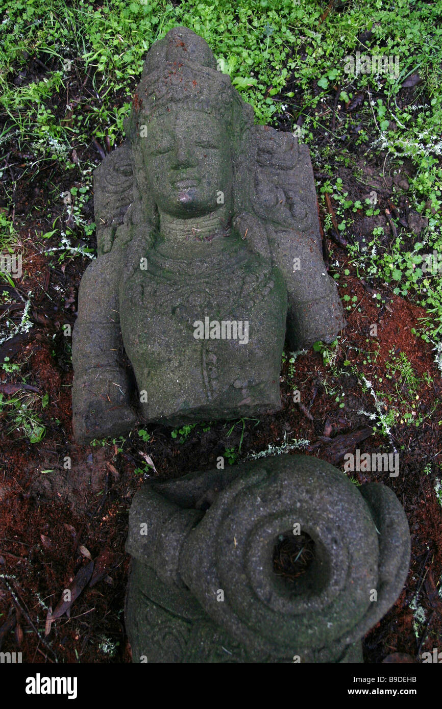 A goddess statue lying on the ground and split in two Stock Photo - Alamy
