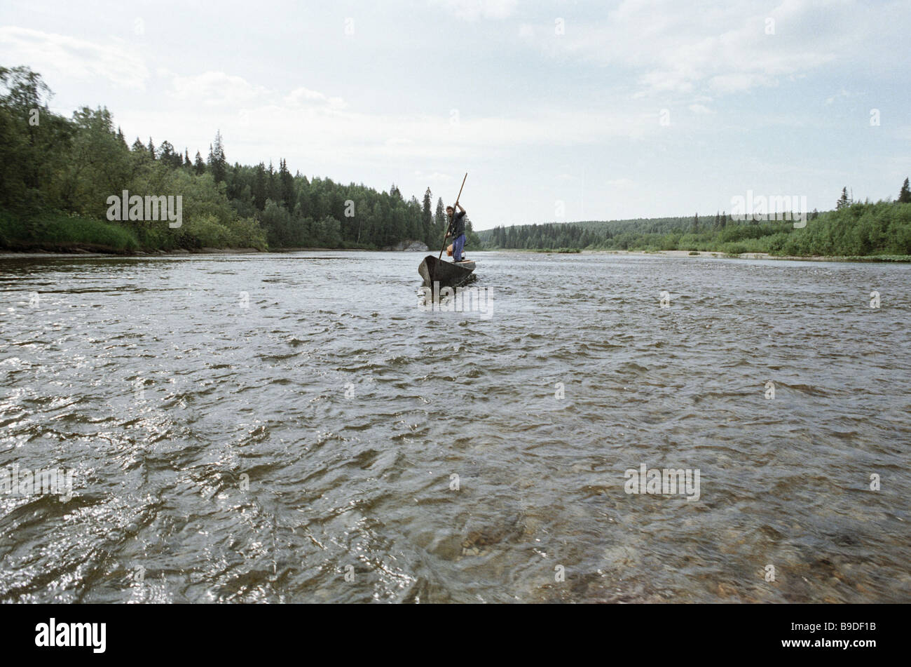 An attendant of the Pechora Ilych nature preserve riding along the ...