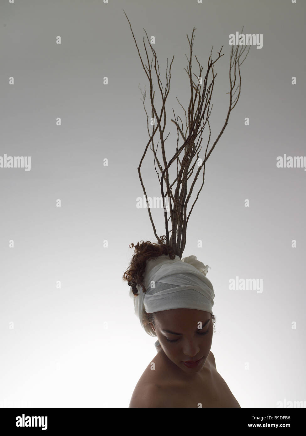 Women with tree branches from head Stock Photo - Alamy