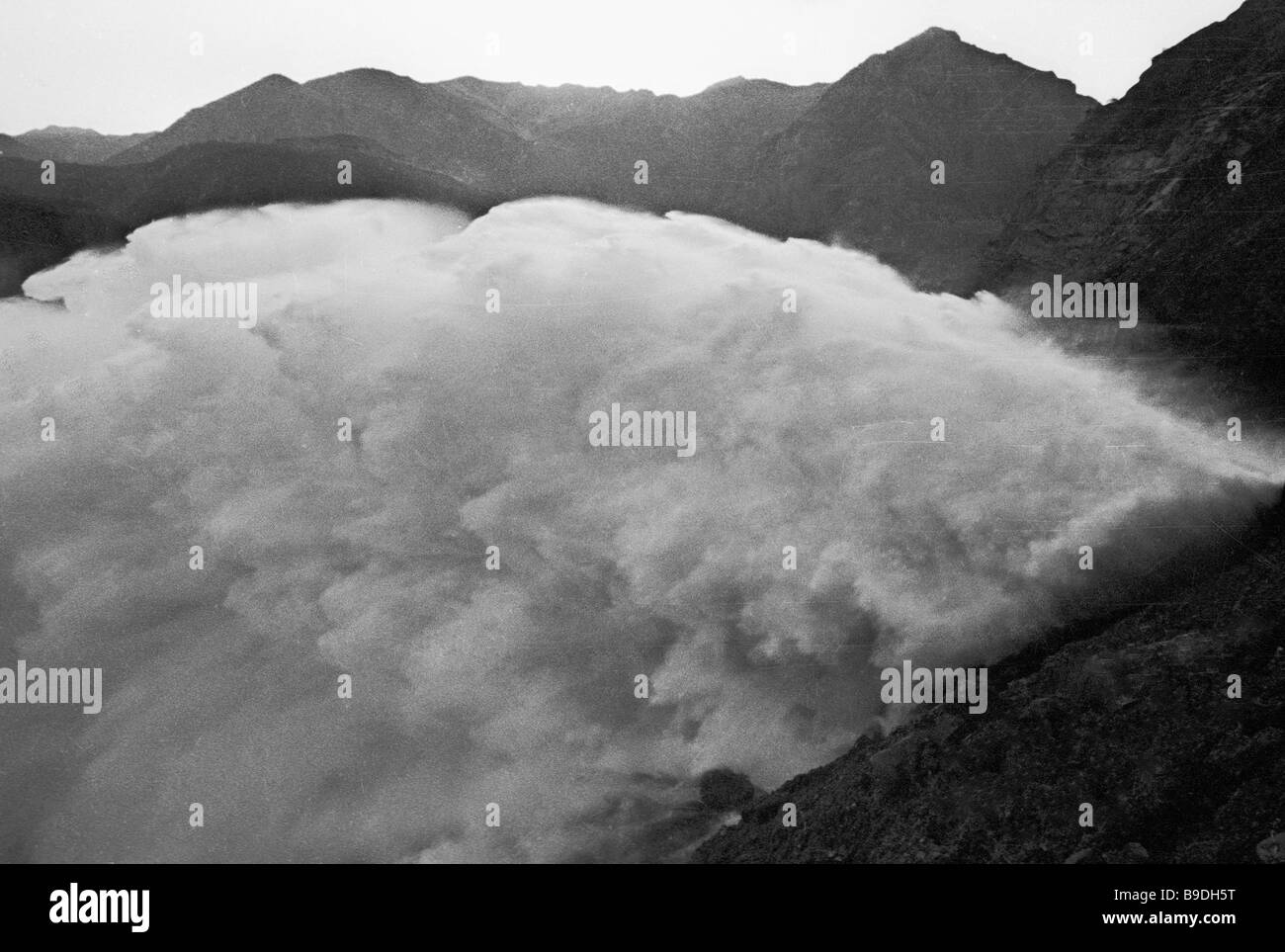 The water of the Vakhsh mountain stream gets out of the Nurek ...