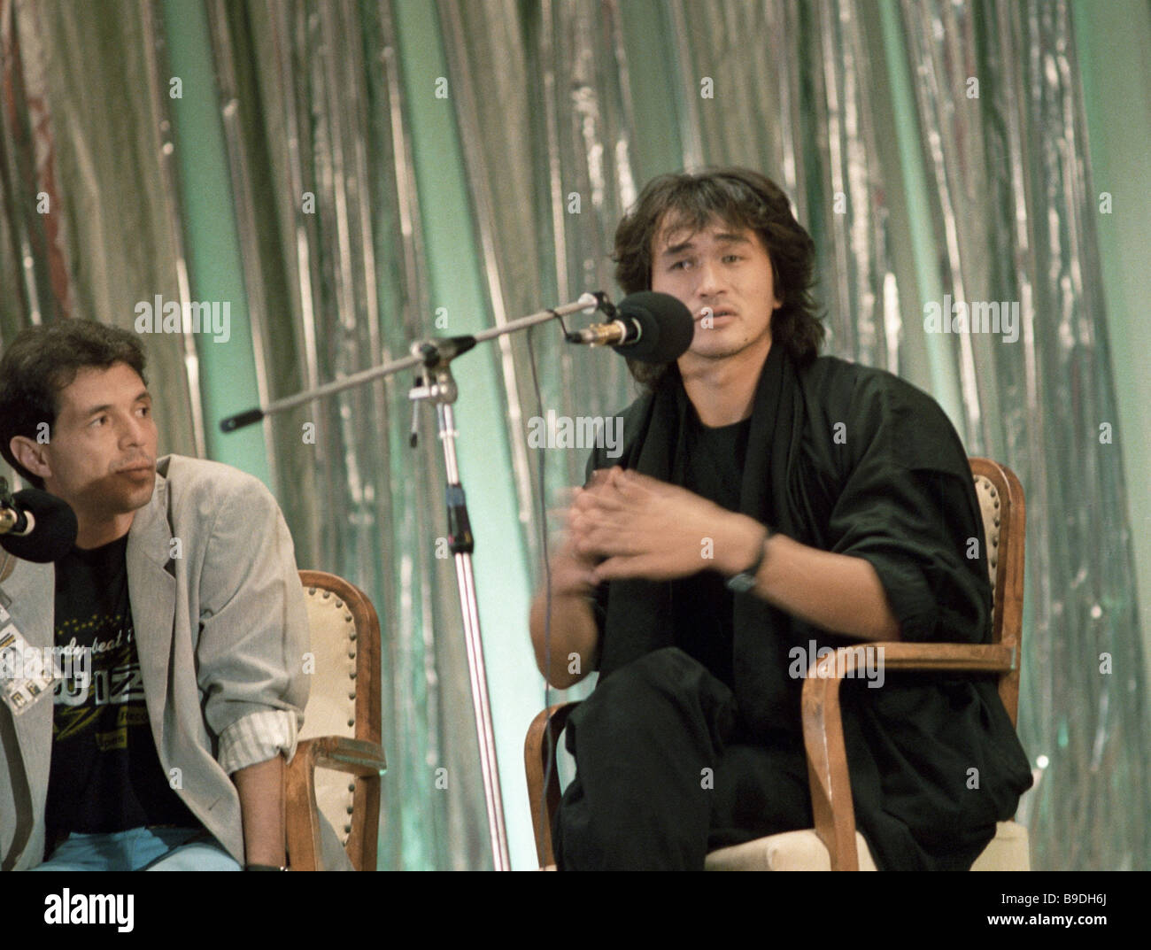 Viktor Tsoi leader of the popular rock group Kino right chats with ...