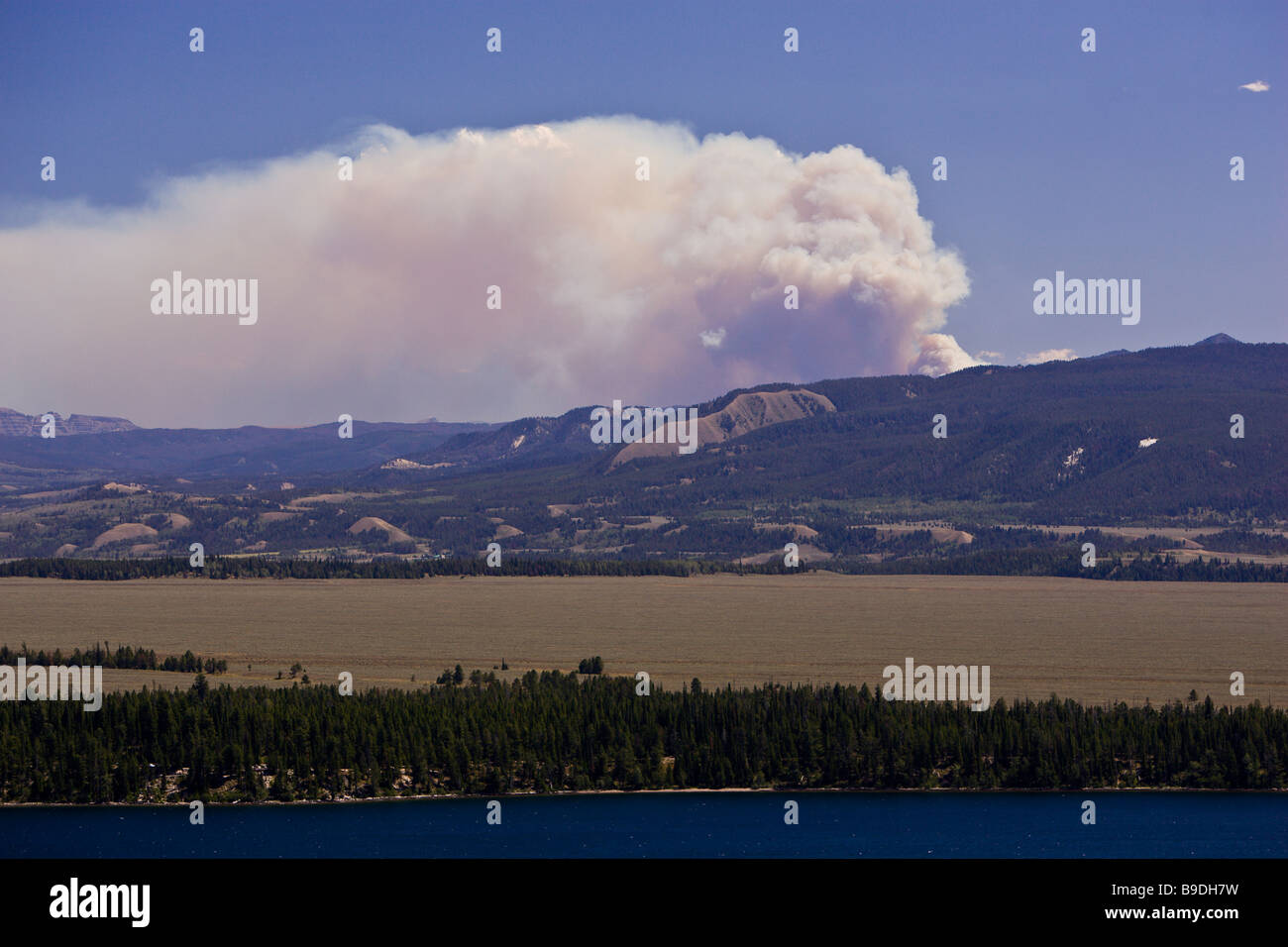 WYOMING USA Smoke rises from forest fire Grand Teton National Park ...