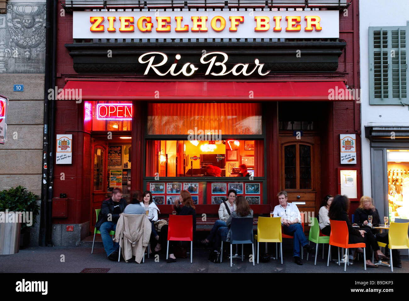 Guests sitting outside a bar at Barfüsserplatz Basel Canton Basel Stadt ...
