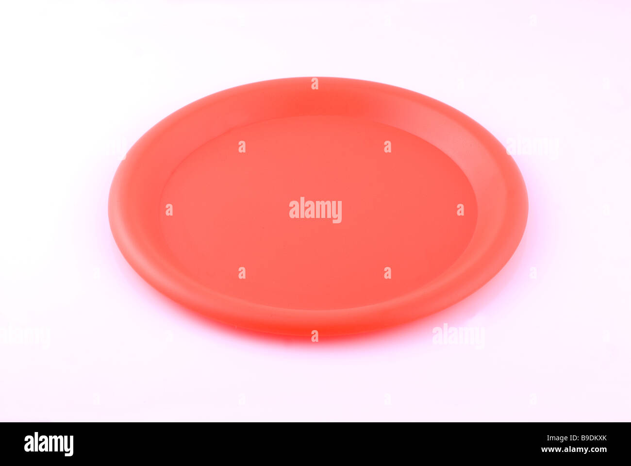 Empty plastic plate cutout against a white background Stock Photo - Alamy