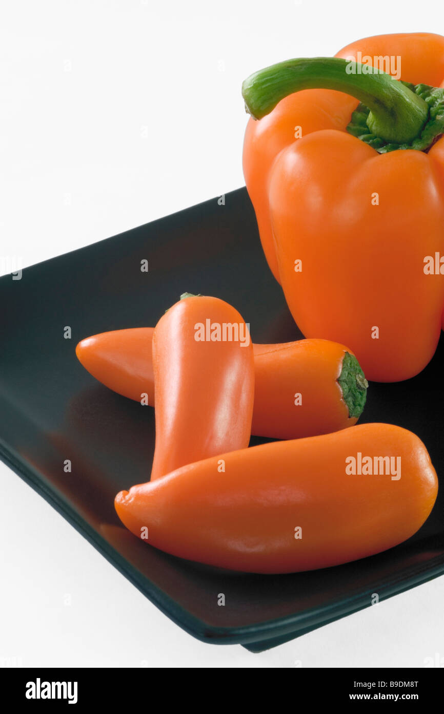 Orange Bellpepper and orange Mini peppers Stock Photo - Alamy