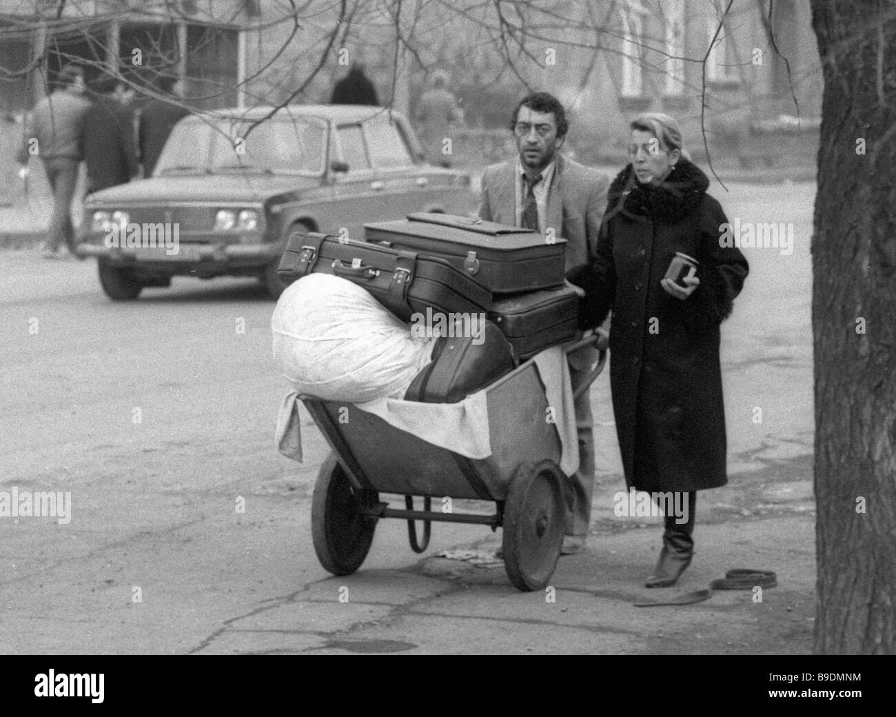 A family that has suffered in the Leninakan earthquake carts away its ...