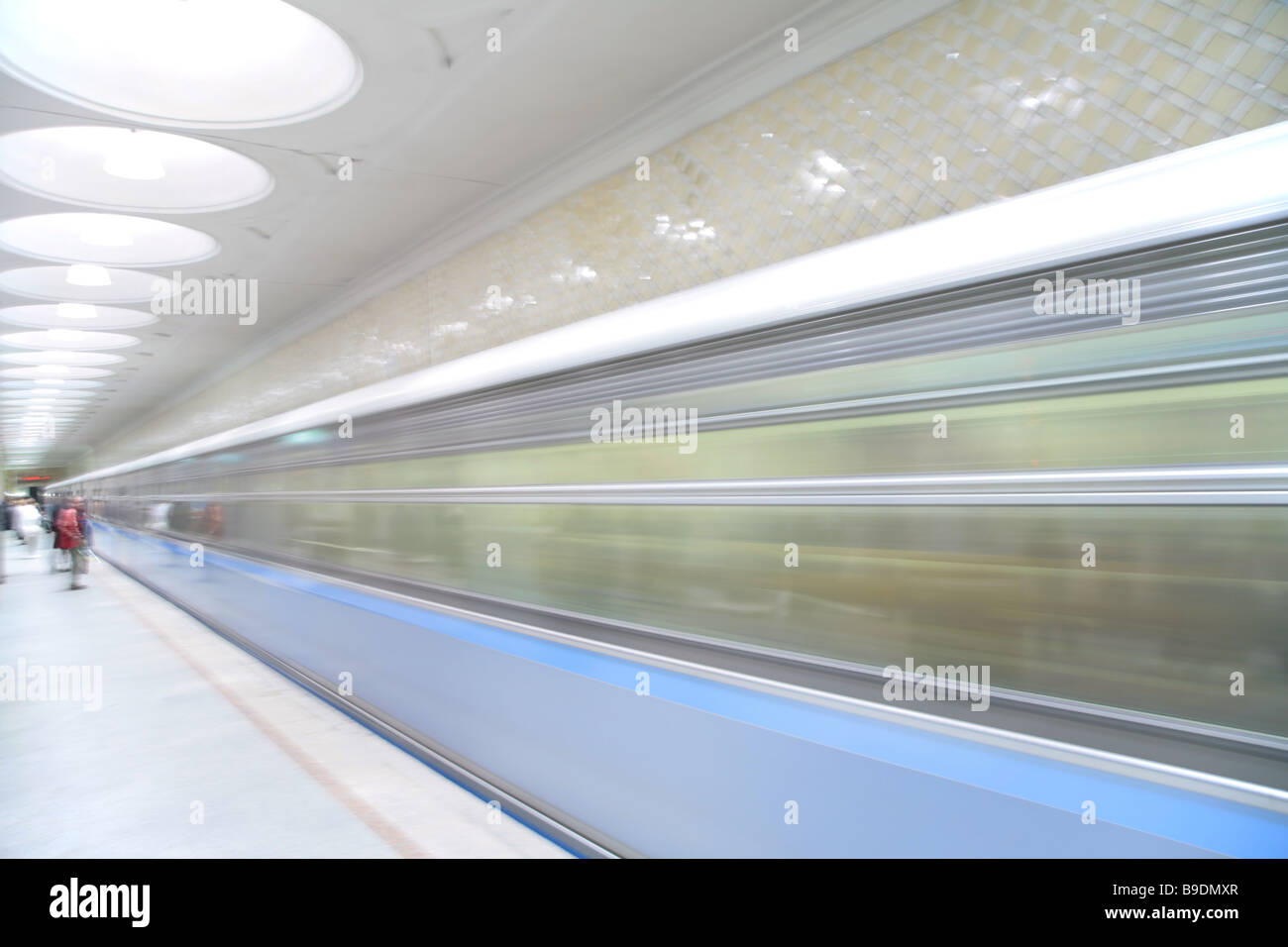 passengers and moving train on metro station Stock Photo - Alamy