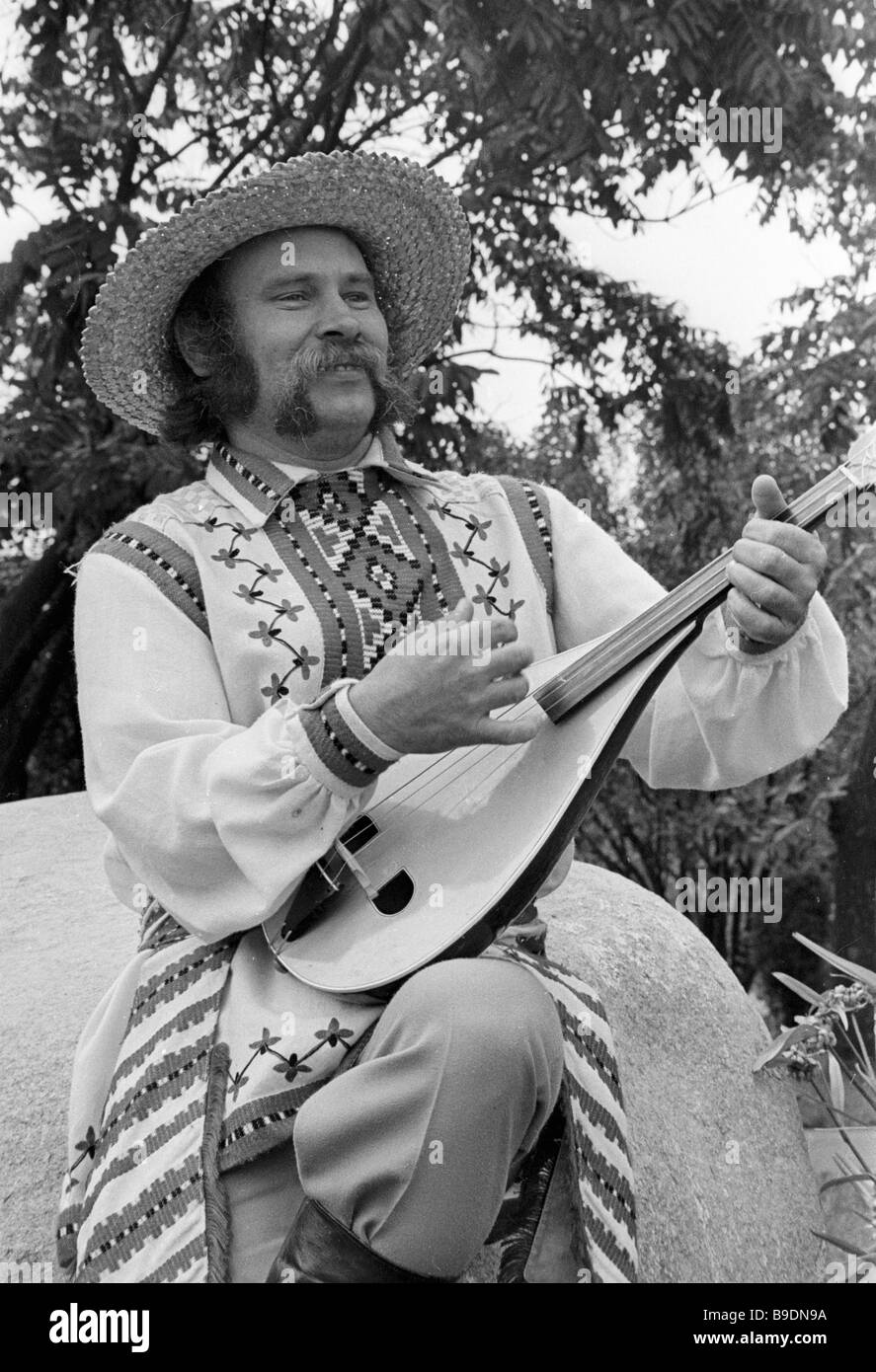 An instrumental soloist of a folklore choreographic group playing a ...