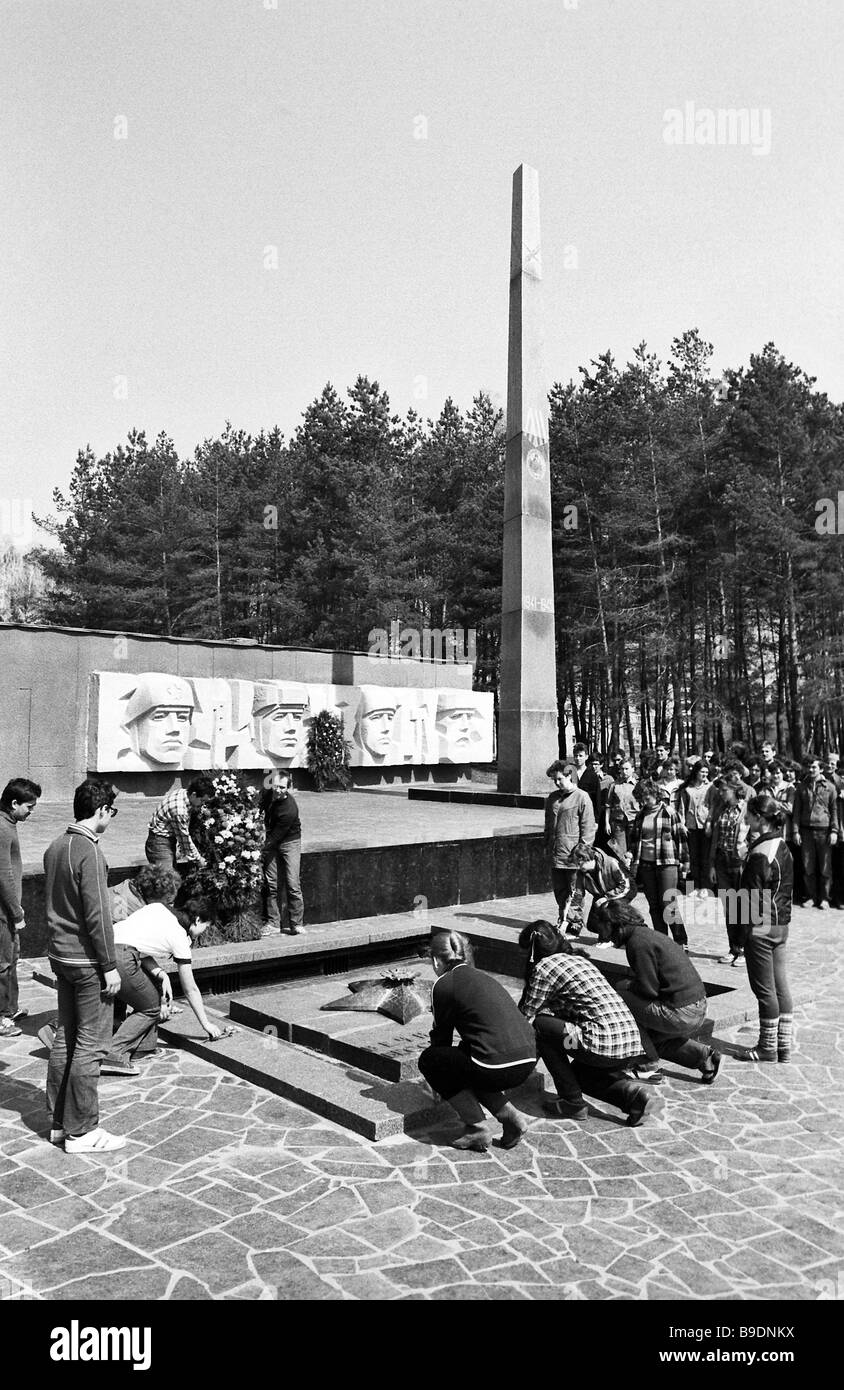 Laying a wreath to World War II soldiers common grave near the village ...