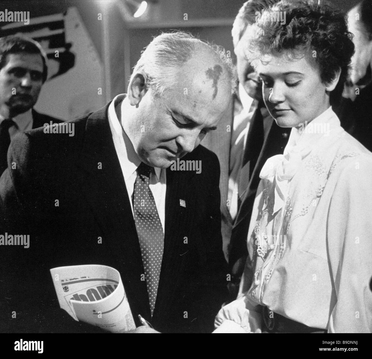 General Secretary of the CPSU Mikhail Gorbachev left signing autographs ...
