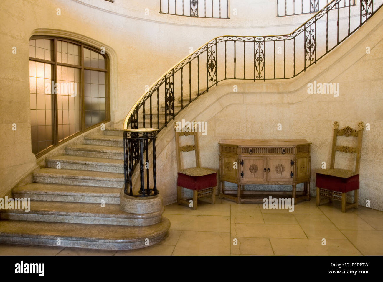 A staircase with antique furniture in the Banff Springs Hotel in Banff ...